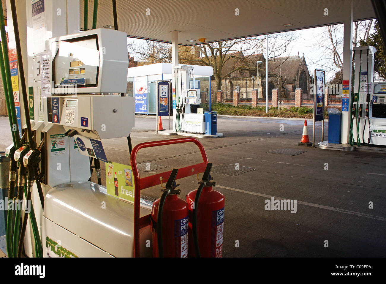 An empty petrol station forecourt with unleaded and diesel fuel closed ...