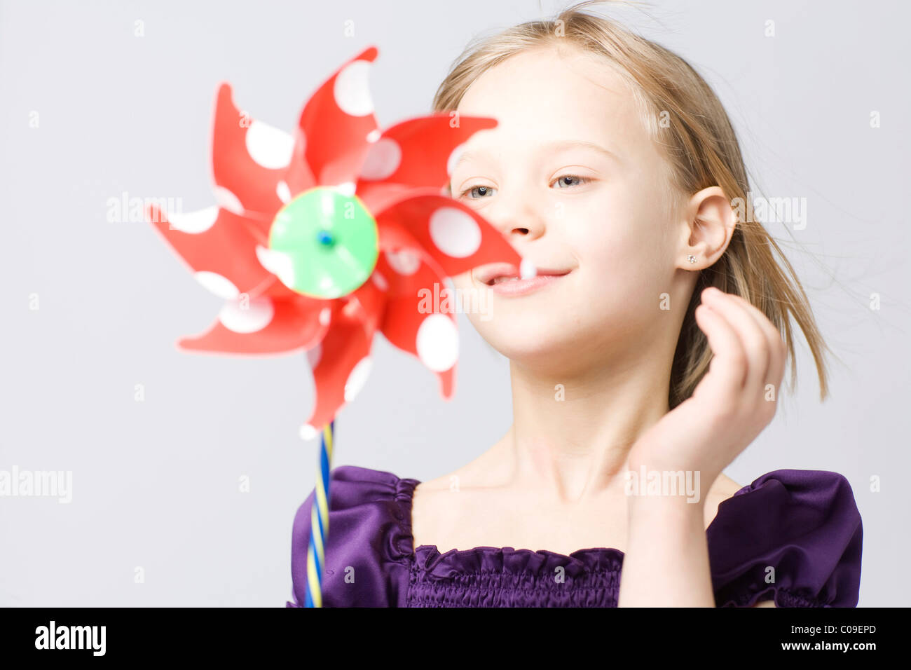Girl with a pinwheel hi-res stock photography and images - Alamy
