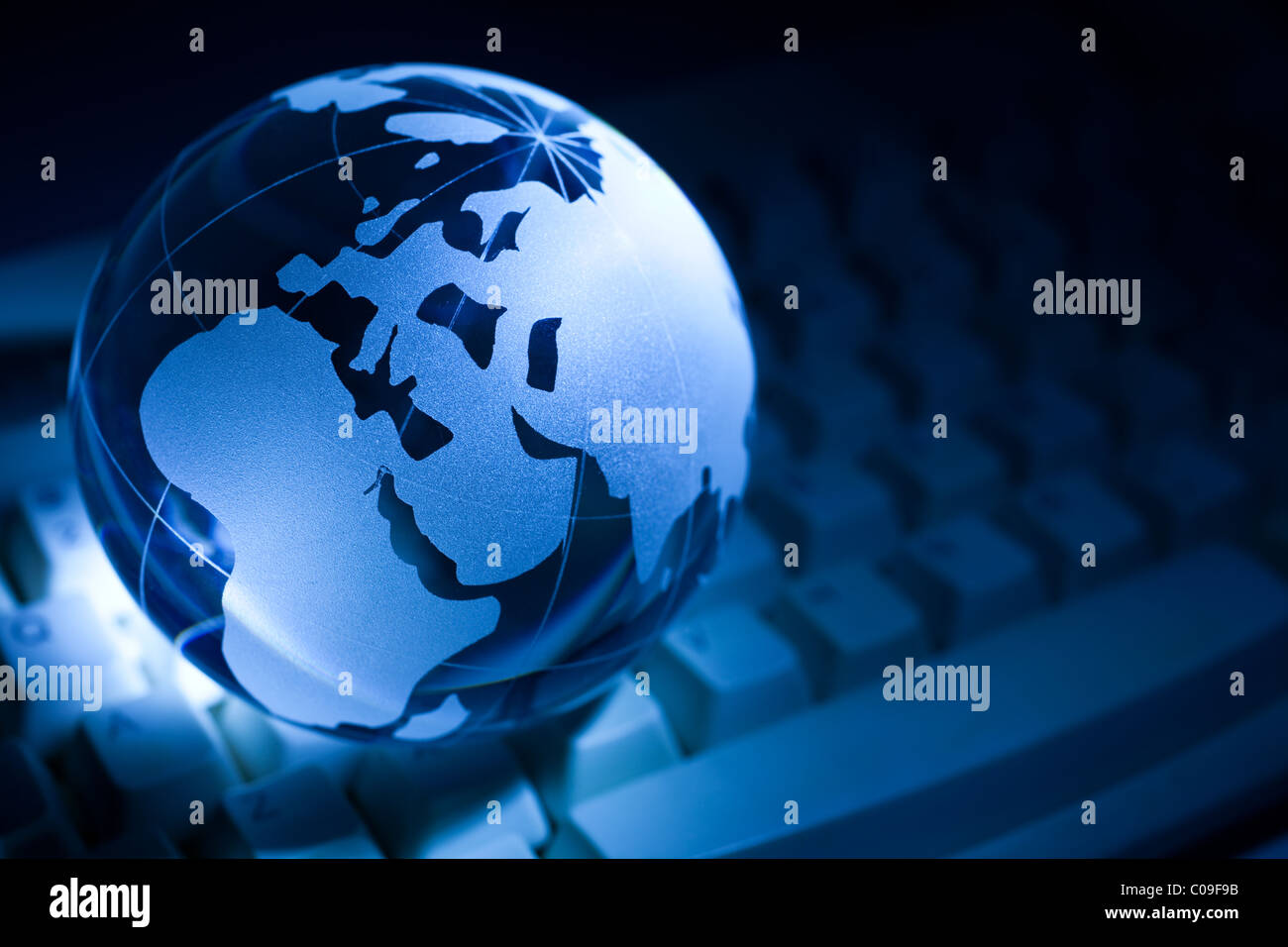 Blue Globe and Computer Keyboard for background Stock Photo - Alamy