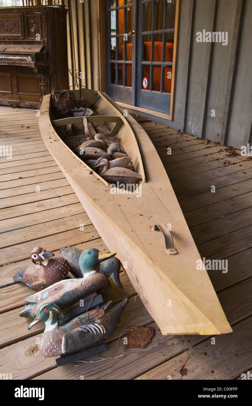 Old Sculling Boat and Duck Decoys on the Porch of a Hunting Lodge in ...