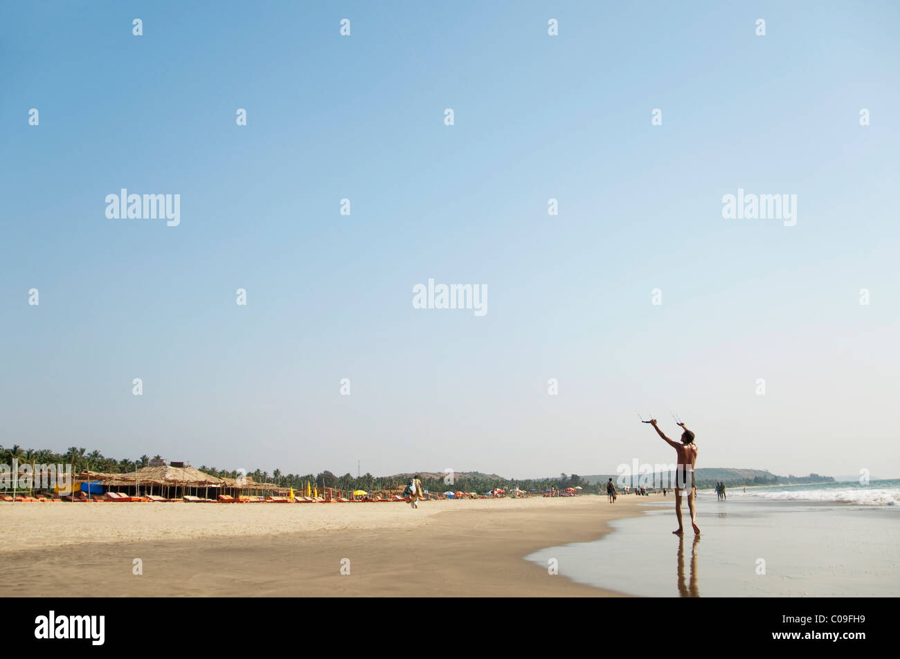 Man standing on the beach, Goa, India Stock Photo - Alamy