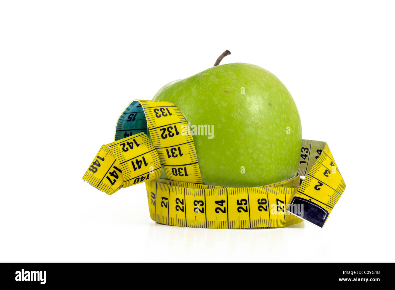 Apple with measuring tape isolated in white Stock Photo - Alamy
