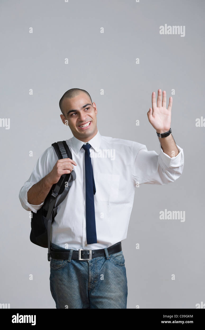 Businessman waving his hand Stock Photo - Alamy