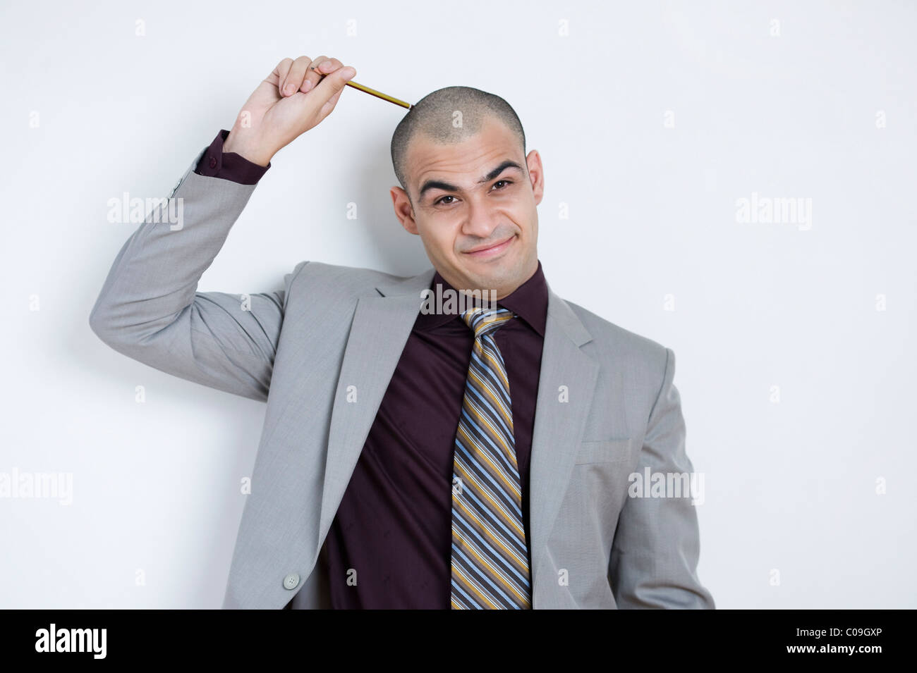 Scratching head holding a camera hi-res stock photography and images ...