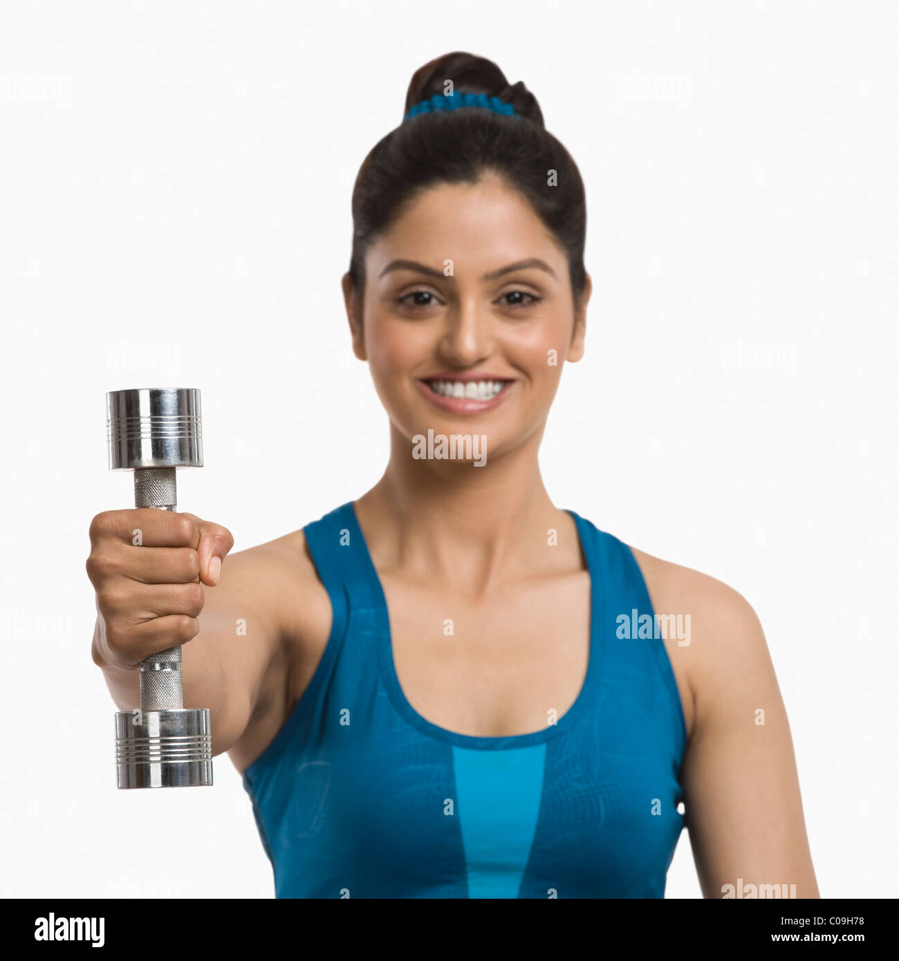 Woman exercising with a dumbbell Stock Photo - Alamy
