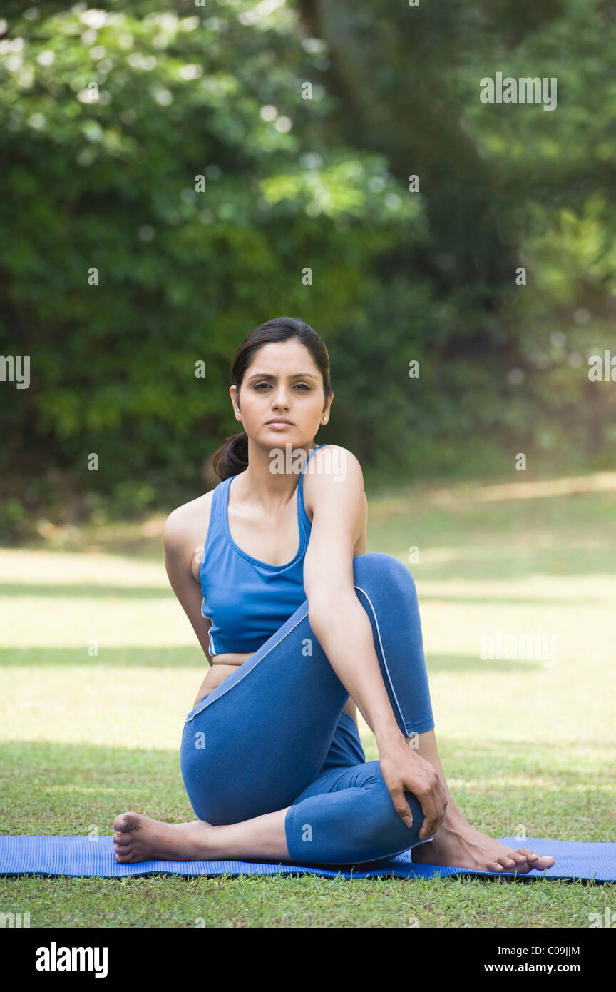 Woman doing Ardha Matsyendrasana (Half Spinal Twist Stock Photo - Alamy