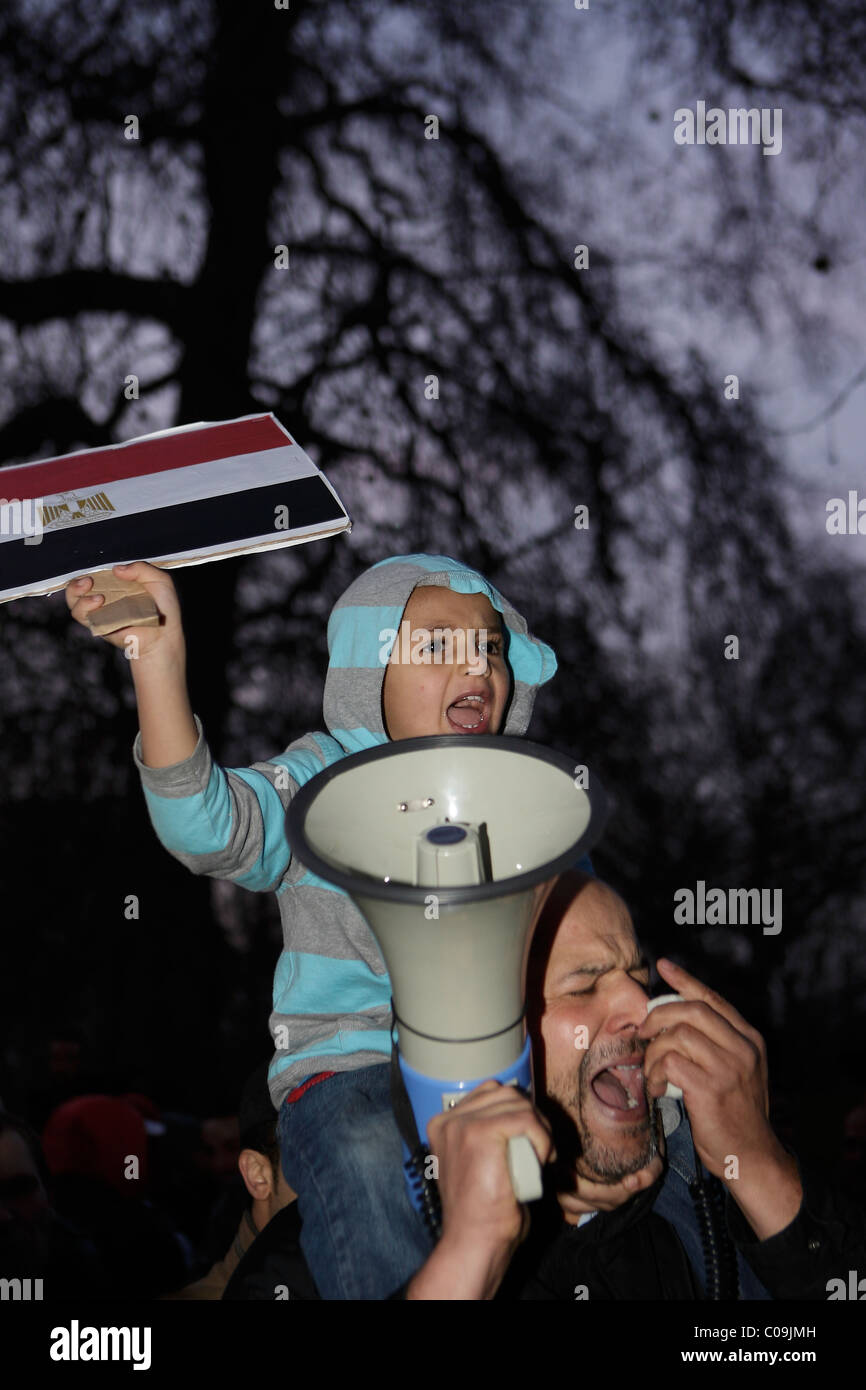 Young child and father shout slogans at Libyan Embassy protests in ...