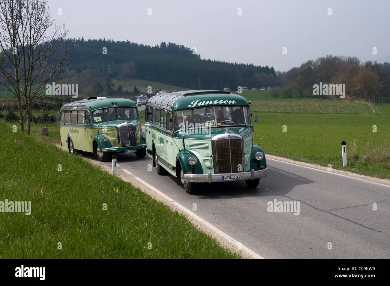 A pair of Mercedes-Benz O3500 take part in a road run for historic ...