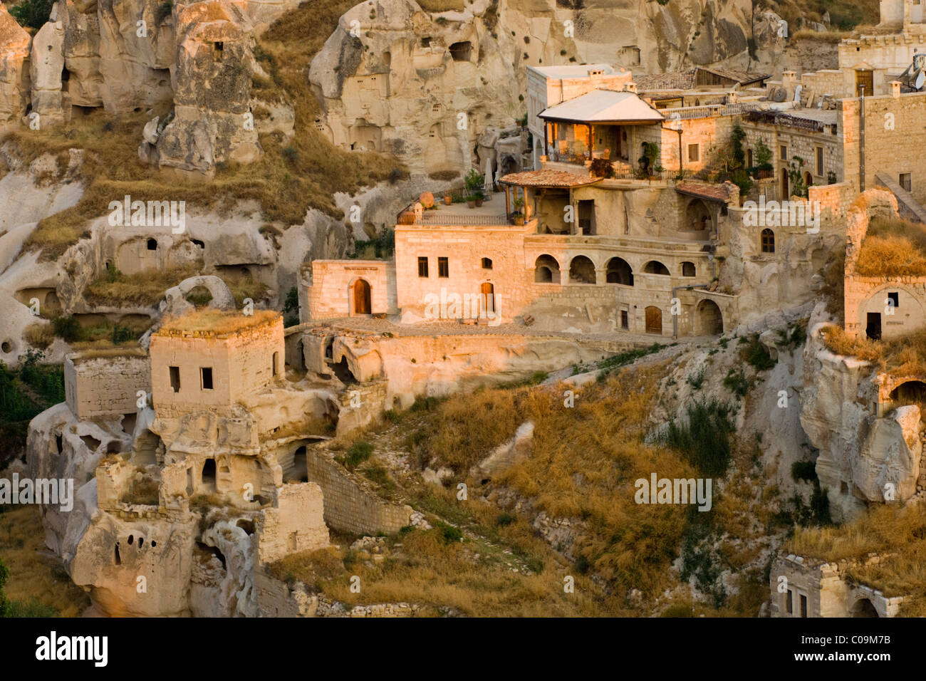Morning light on cave houses in Ortahisar, Cappadocia, Anatolia, Turkey ...