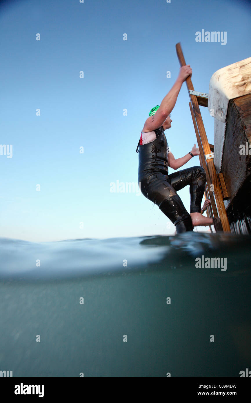 Swimmers exiting water at a Triathlon Stock Photo - Alamy