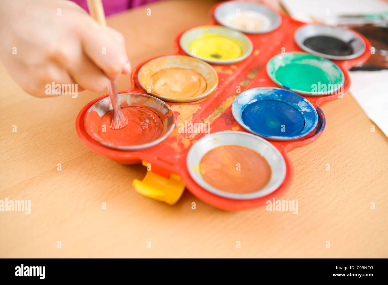A girl painting with water colours Stock Photo - Alamy