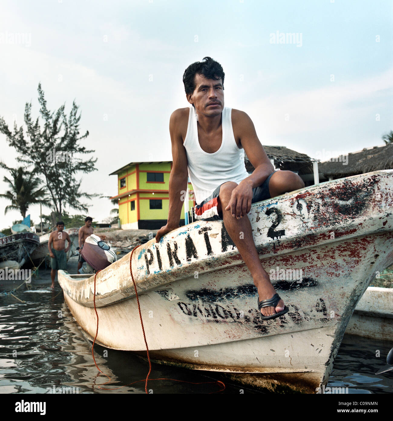 A Mexican fisherman waits on his boat in Puerto Madero Stock Photo - Alamy