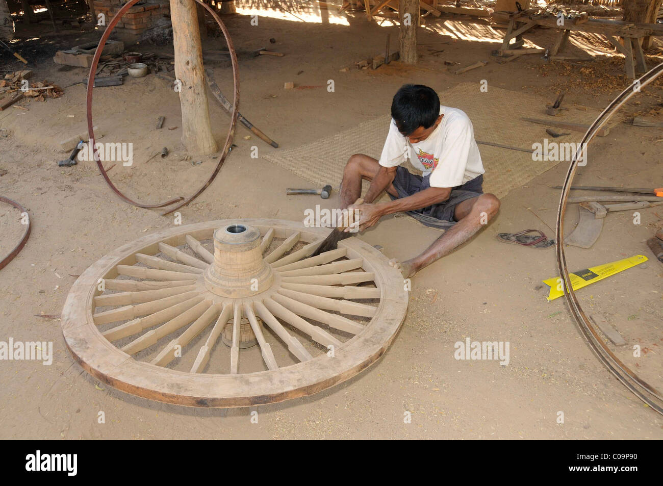 Wheelwright's workshop, production of wooden spoke wheels in a village ...