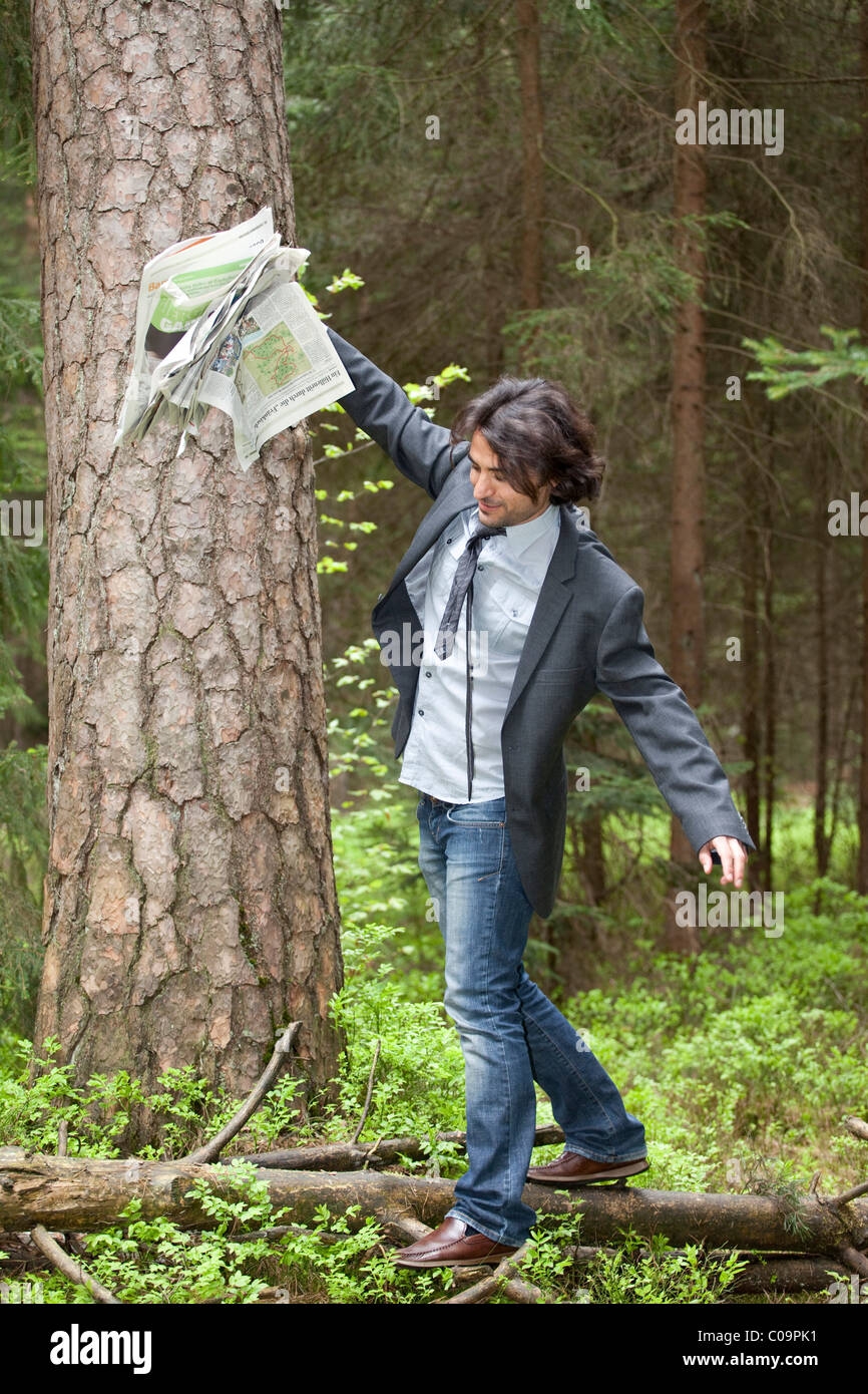 Young man balancing on a log hi-res stock photography and images - Alamy