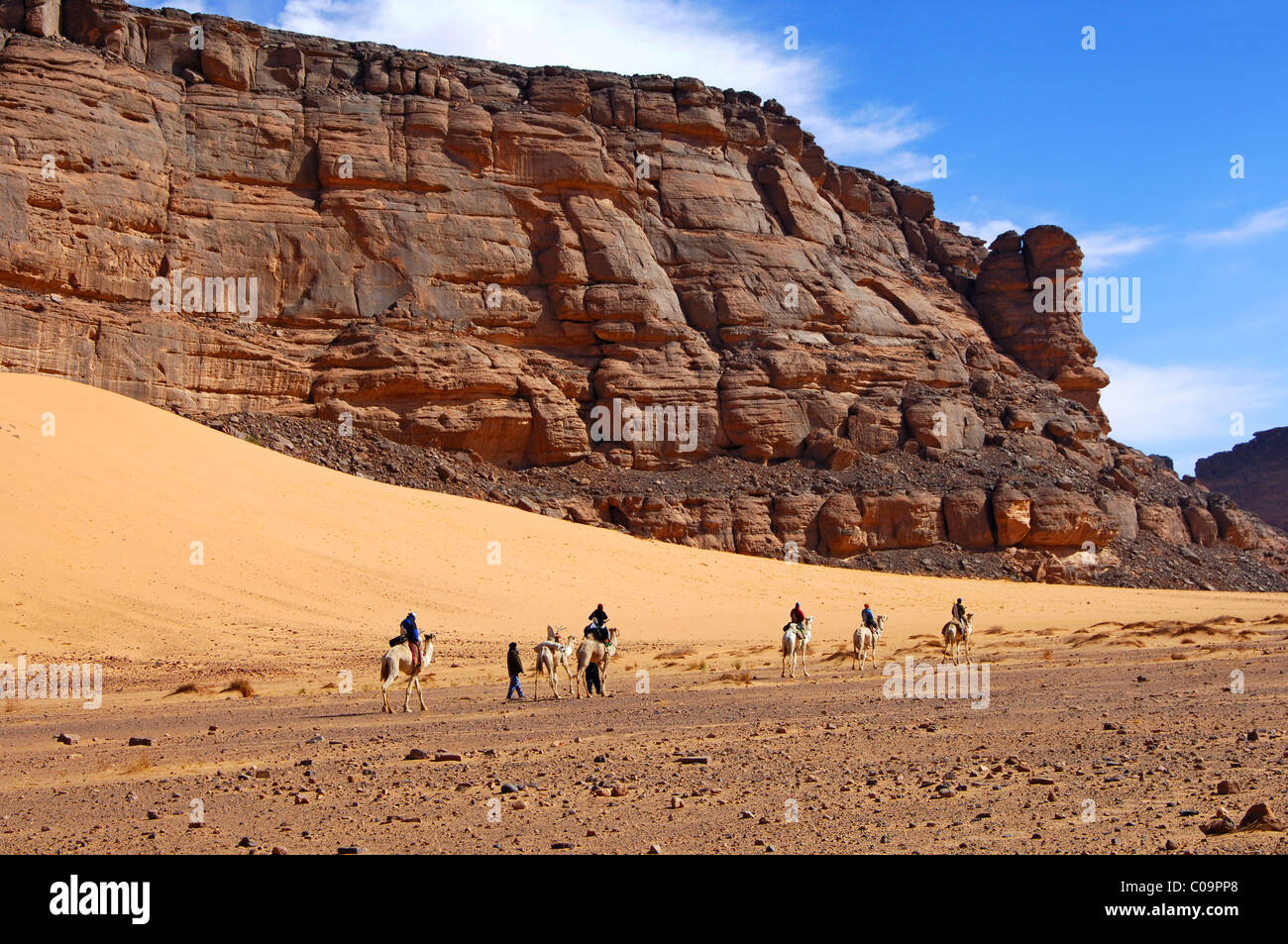 Tourists riding camels in a wadi in the Sahara, Libya, Africa Stock ...