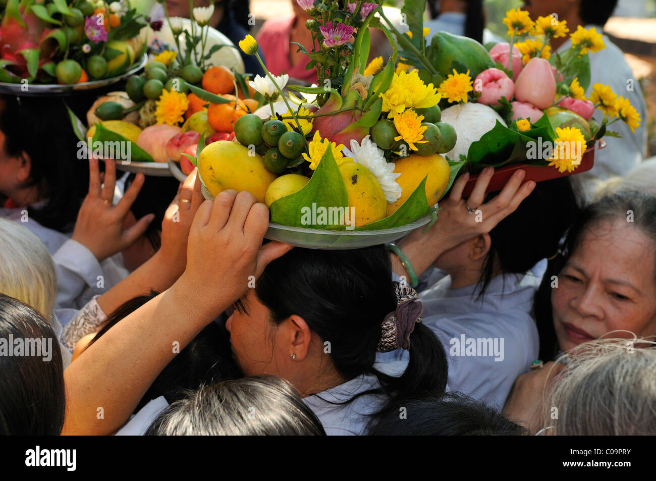 Women with sacrificial offerings at the largest and most important ...