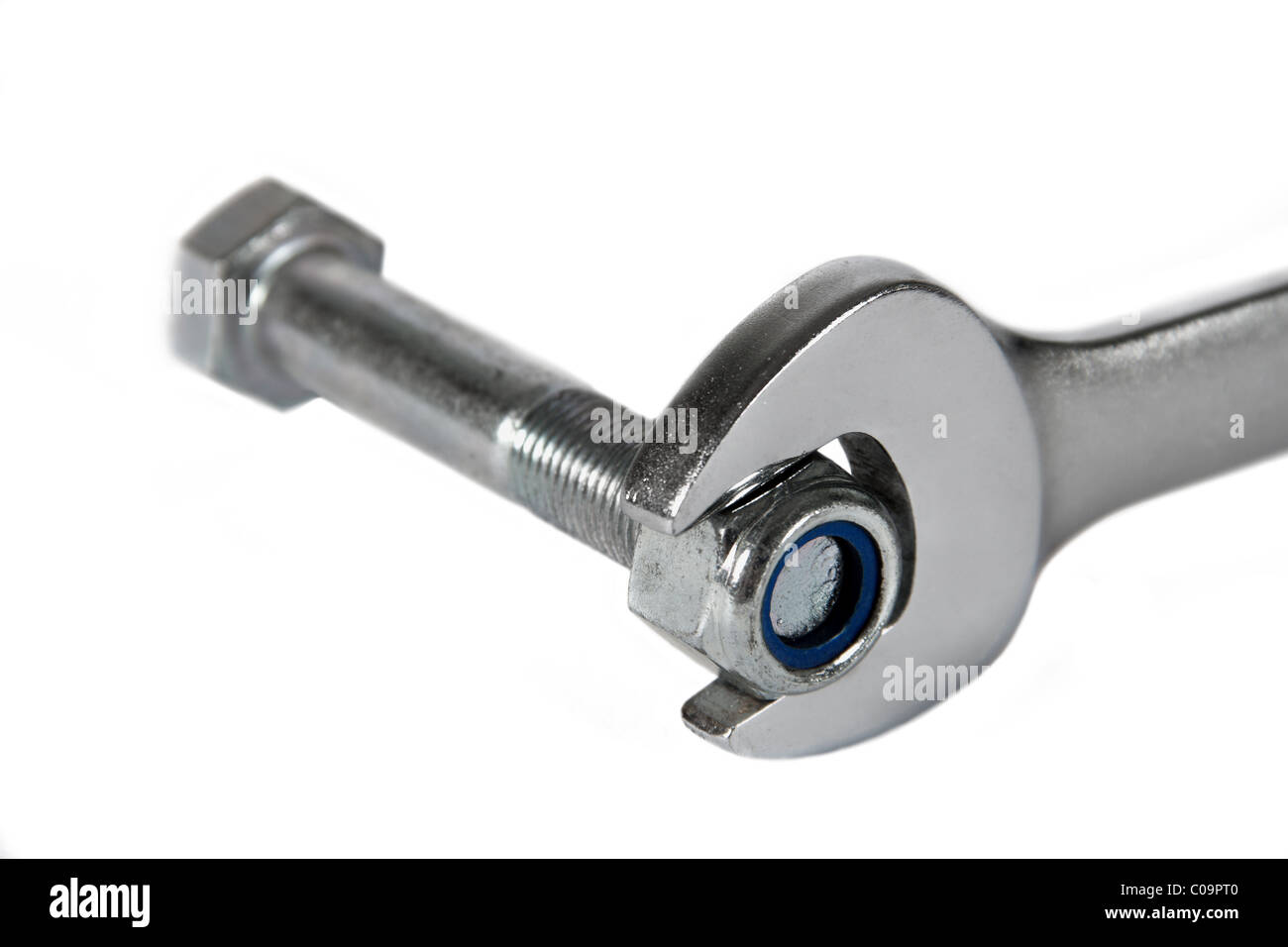 The image of the wrench which is turning off a nut from a bolt ...