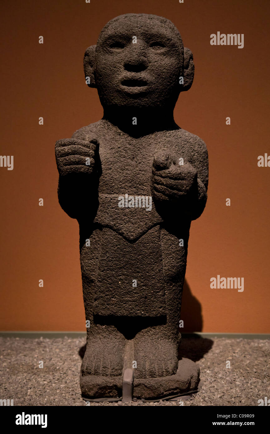 Statue depicting an Aztec warrior with triangular motif in the National ...