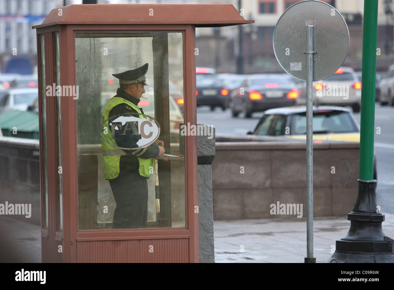 Police man smoking a cigarette in his booth in central Moscow Stock ...