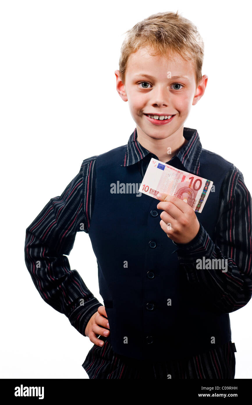 A boy, 8 years, with a 10 euro note in his hand Stock Photo - Alamy