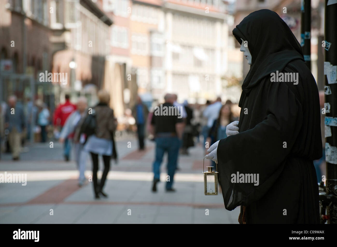 Mendicant in a town centre Stock Photo - Alamy