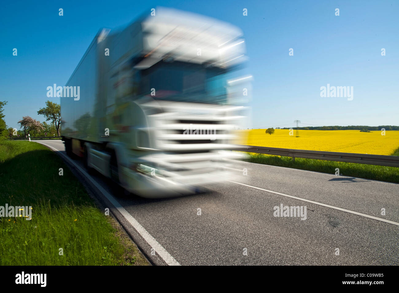 Truck driving at high speed on a highway Stock Photo - Alamy