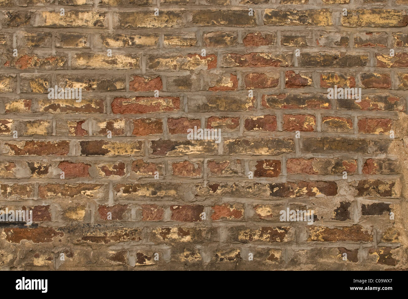 Brick wall with remnants of plaster, background Stock Photo - Alamy