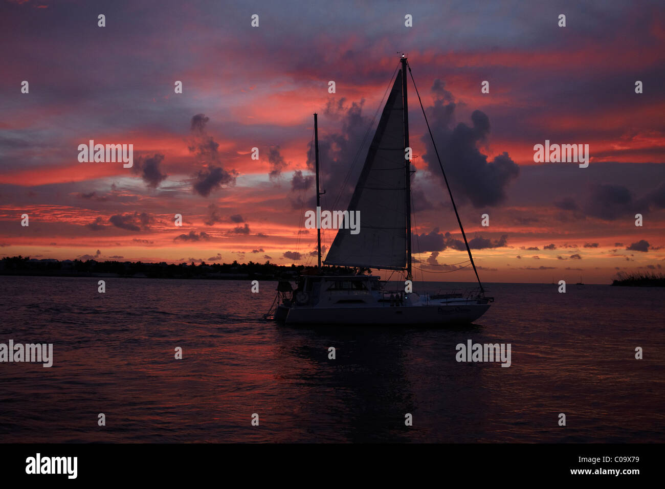 sailboat at Sunset Stock Photo - Alamy