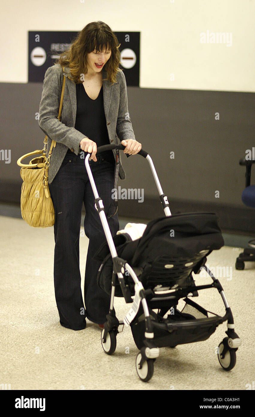 Milla Jovovich with her baby daughter Ever Gabo at LAX airport Los ...