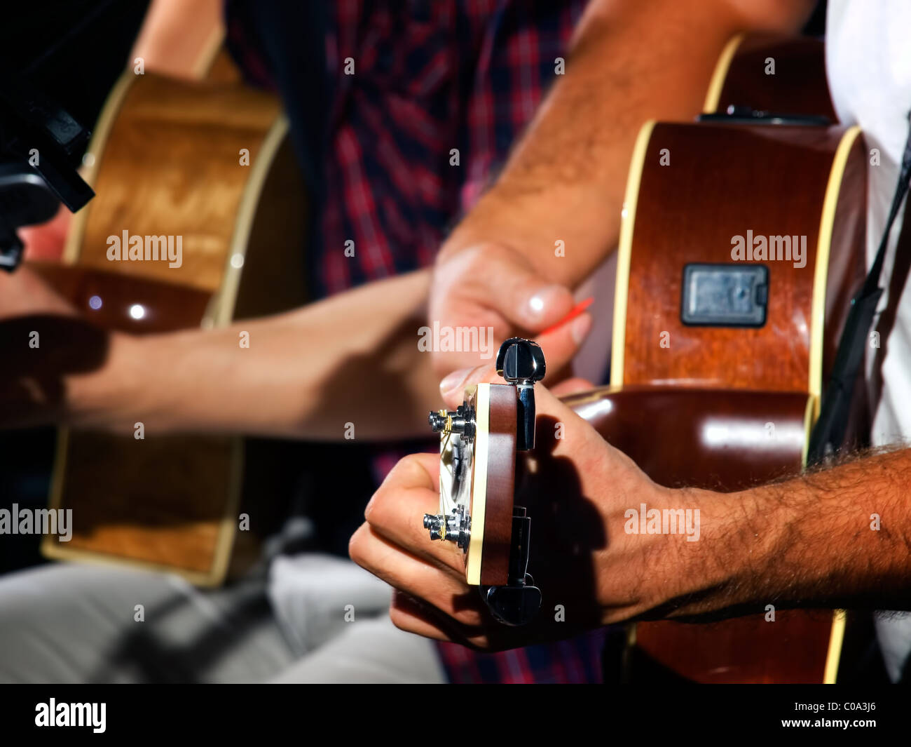Detail of two guitar players on stage during the concert Stock Photo ...