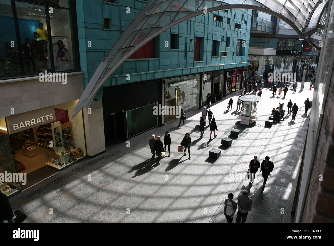 looking down on the inside of a shopping mall. Shopping Mall packed ...