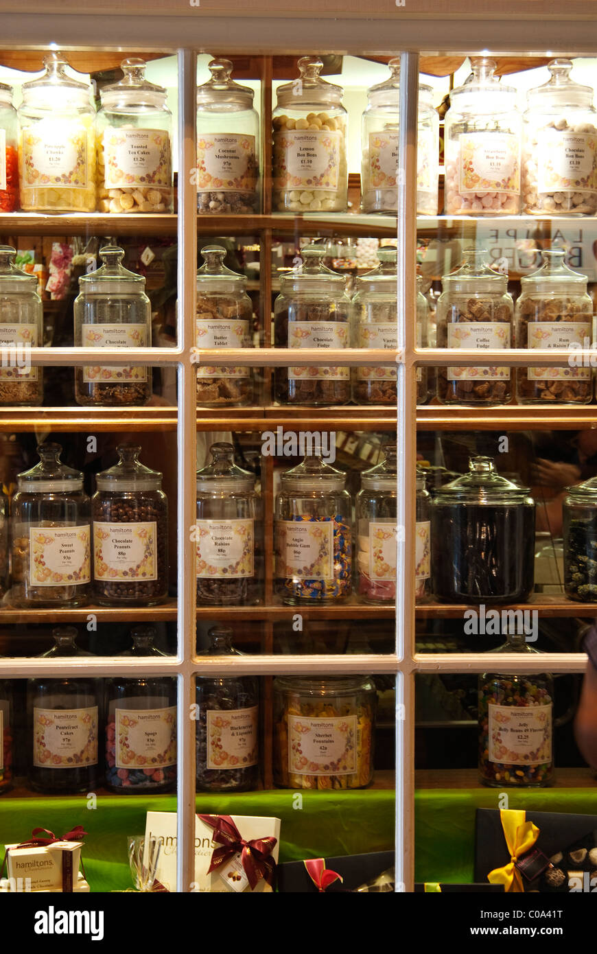 Sweet shop window full of jars of sweets and confectionery Stock Photo ...
