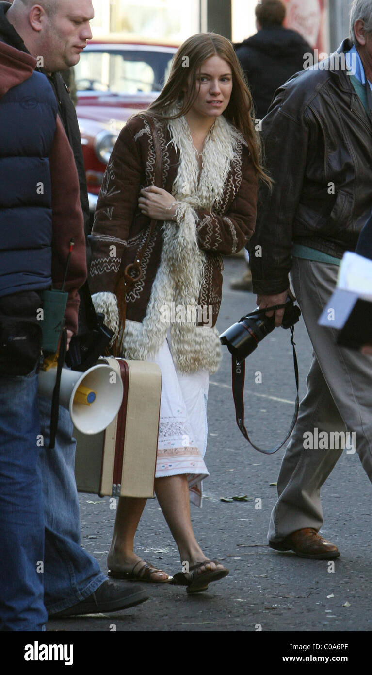 Sienna Miller dressed in vintage clothes and filming a scene for her ...