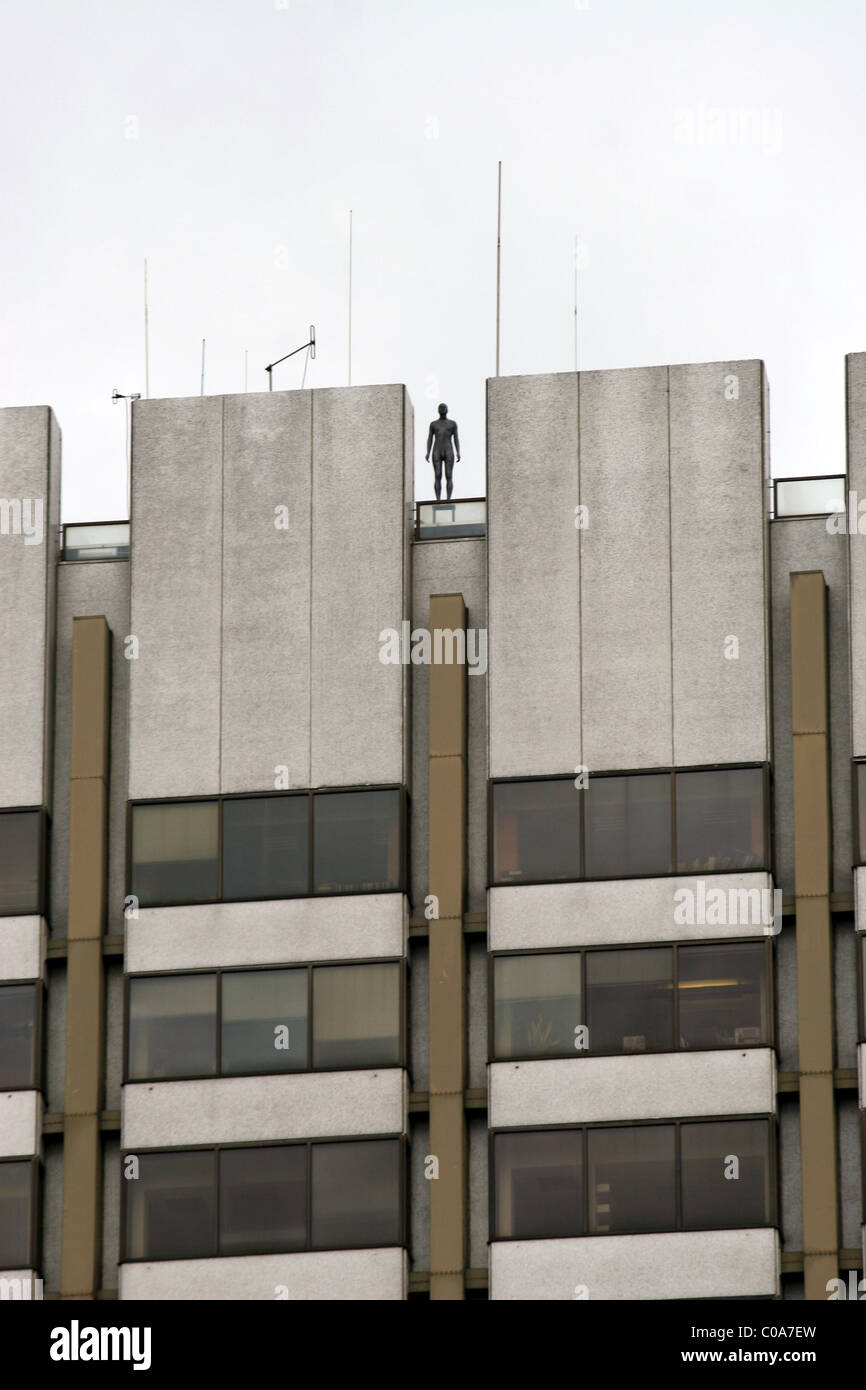 Antony Gormley sculpture on the rooftop of the ITV building. Part of ...