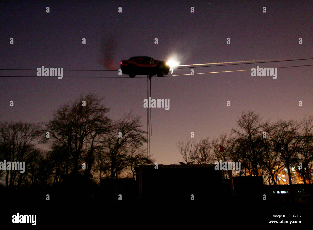 DRIVER TAKES A TIGHT-ROPE ROUTE This mad motorist will drive his car ...