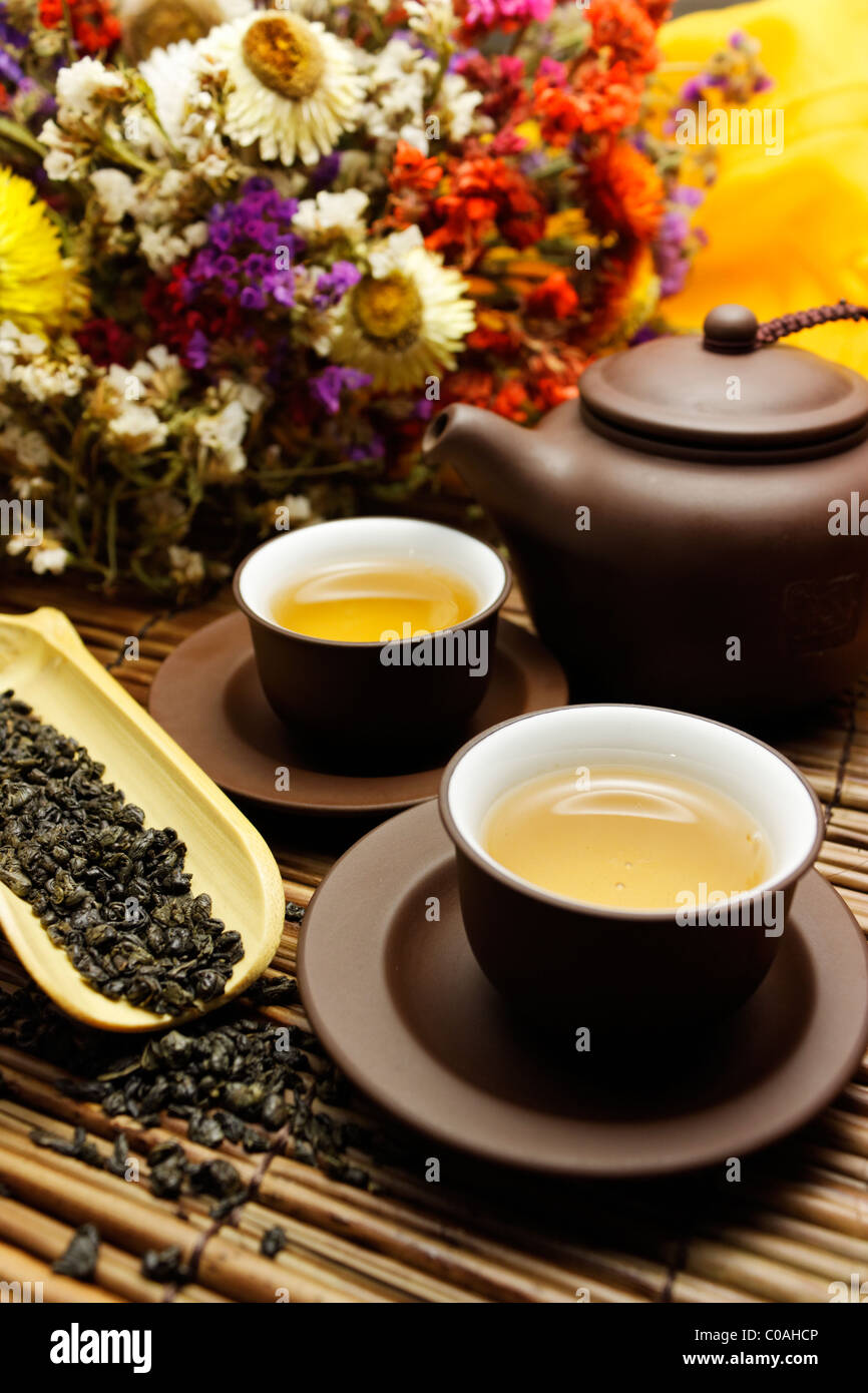 Asian tea set with bunch of wild flowers Stock Photo - Alamy
