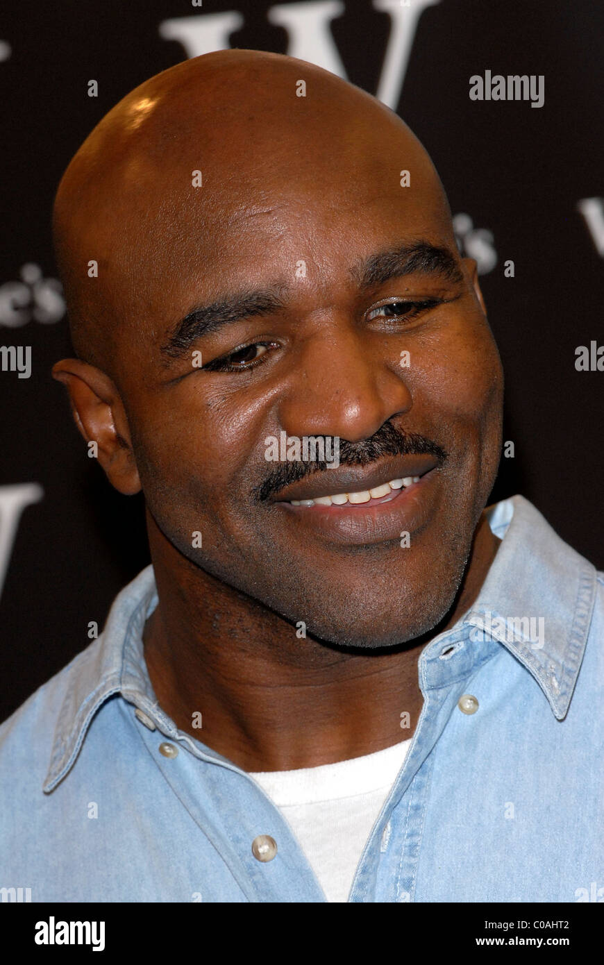 Evander Holyfield signs copies of his new book 'Becoming Holyfield: A ...