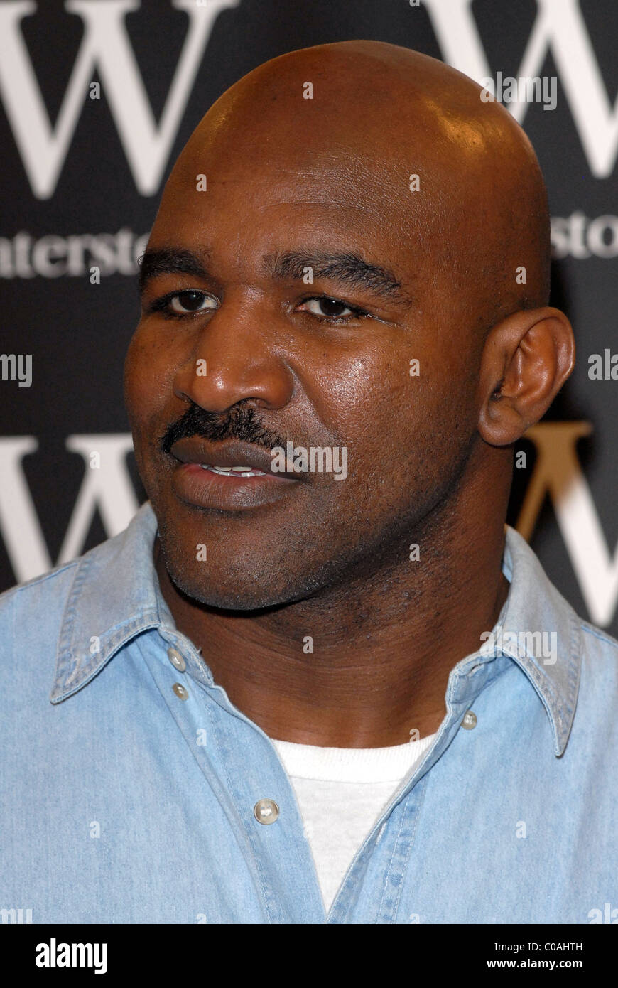 Evander Holyfield signs copies of his new book 'Becoming Holyfield: A ...