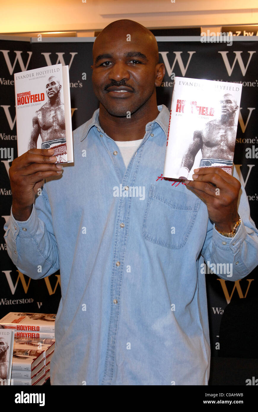 Evander Holyfield signs copies of his new book 'Becoming Holyfield: A ...