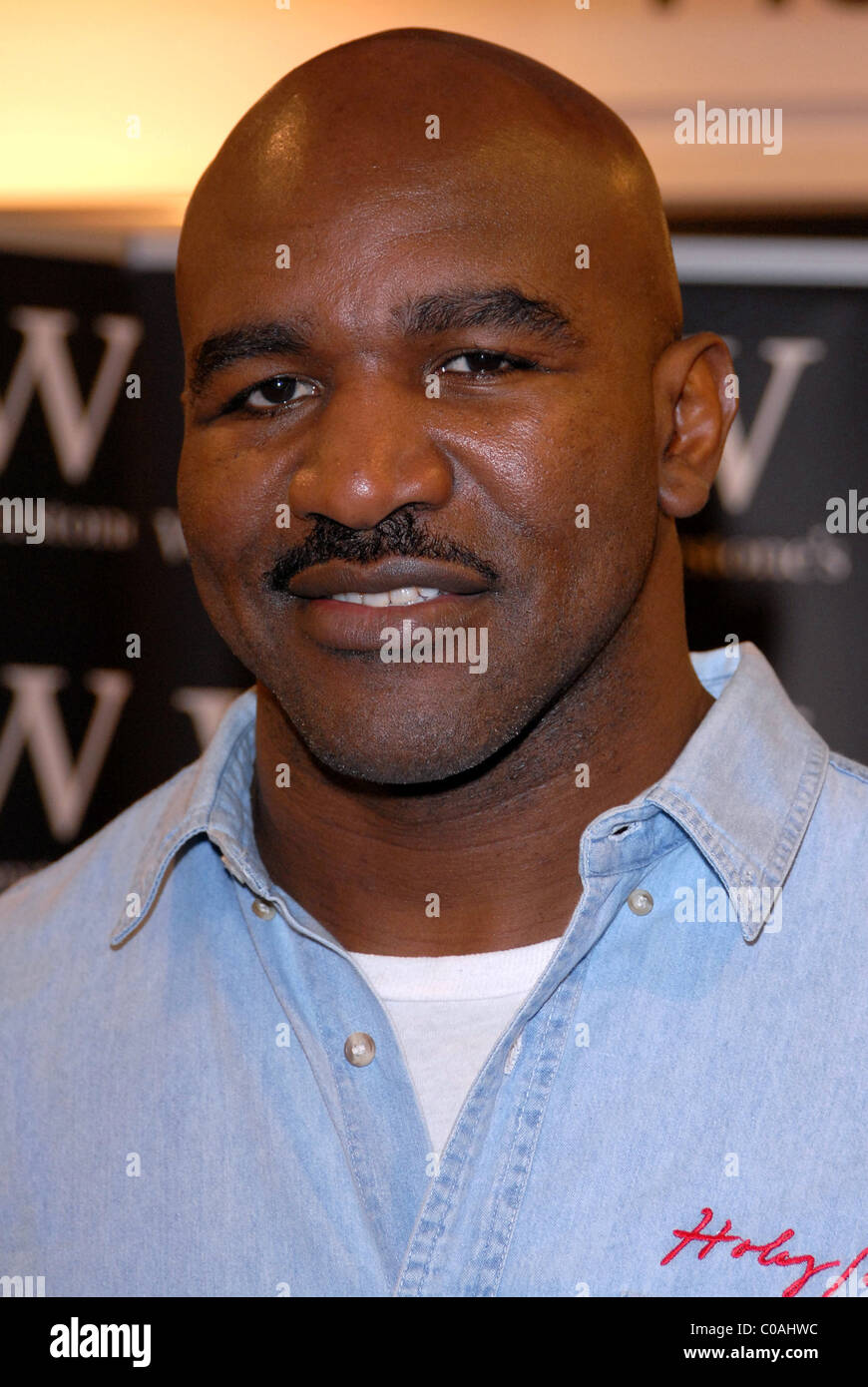 Evander Holyfield signs copies of his new book 'Becoming Holyfield: A ...