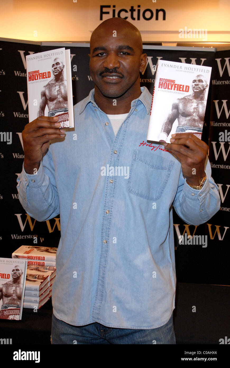 Evander Holyfield signs copies of his new book 'Becoming Holyfield: A ...