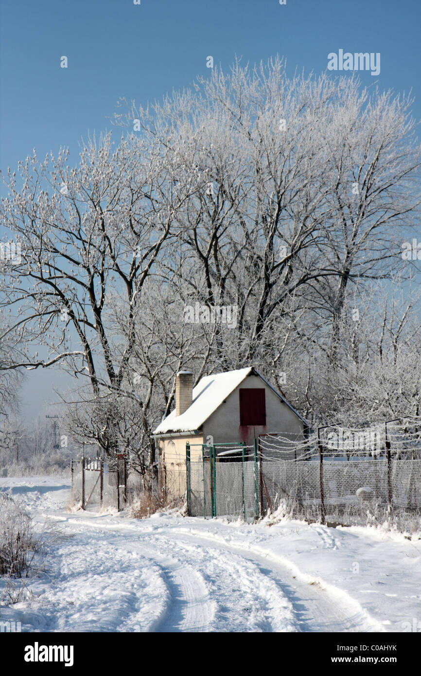 Small cottage in winter Stock Photo - Alamy
