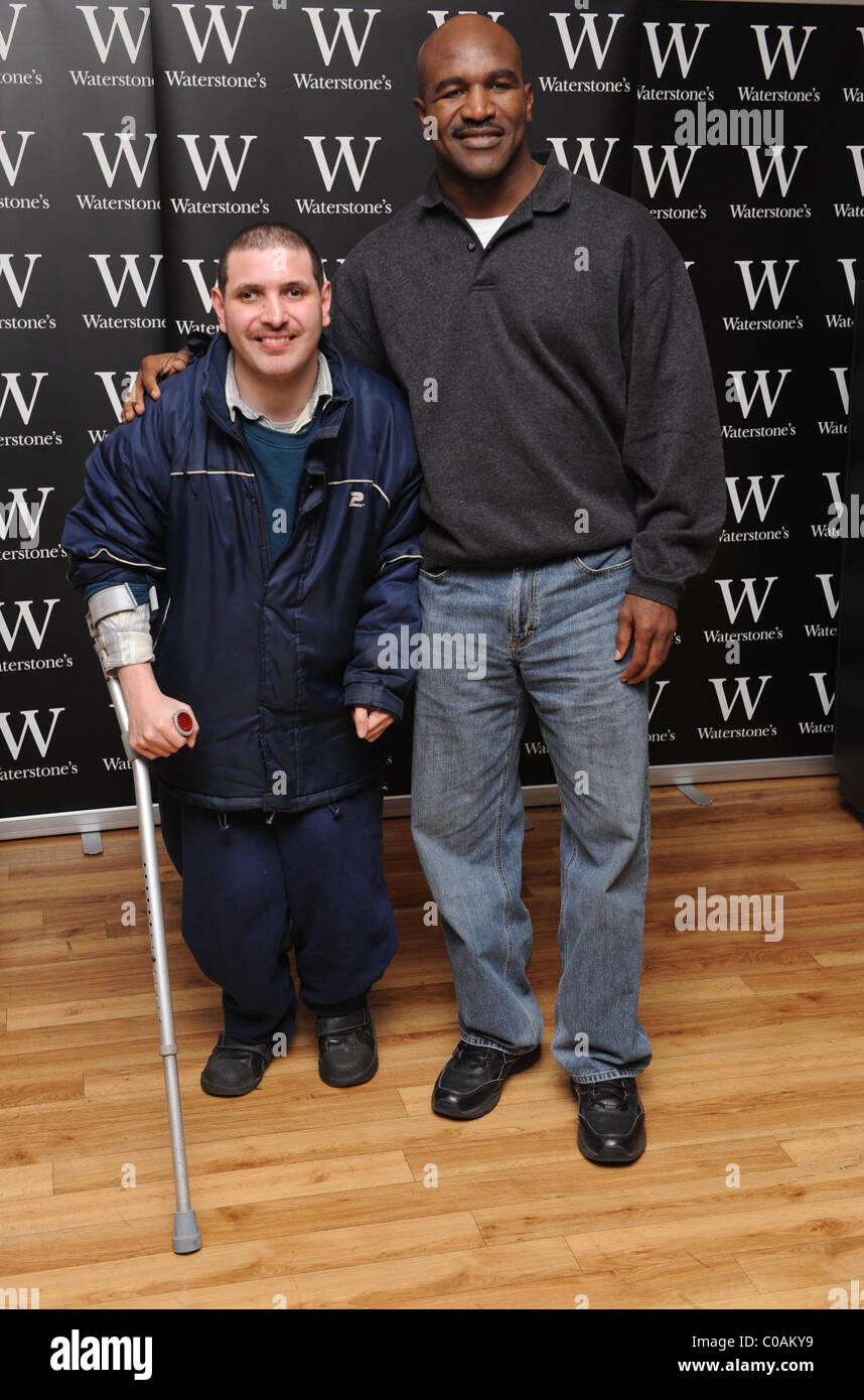 Evander Holyfield signs copies of his new book 'Becoming Holyfield' at ...