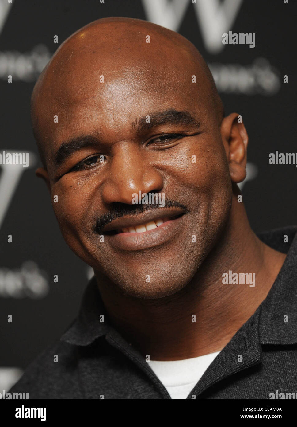 Evander Holyfield signs copies of his new book 'Becoming Holyfield' at ...