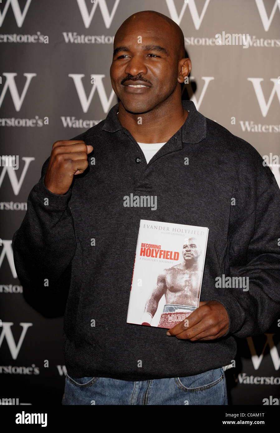 Evander Holyfield signs copies of his new book 'Becoming Holyfield' at ...