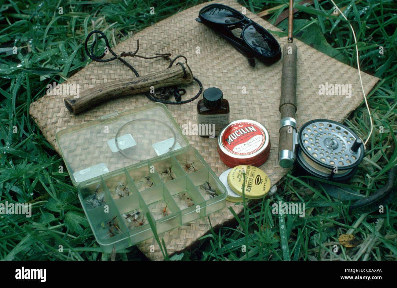 Fishing equipment on the river bank Stock Photo - Alamy