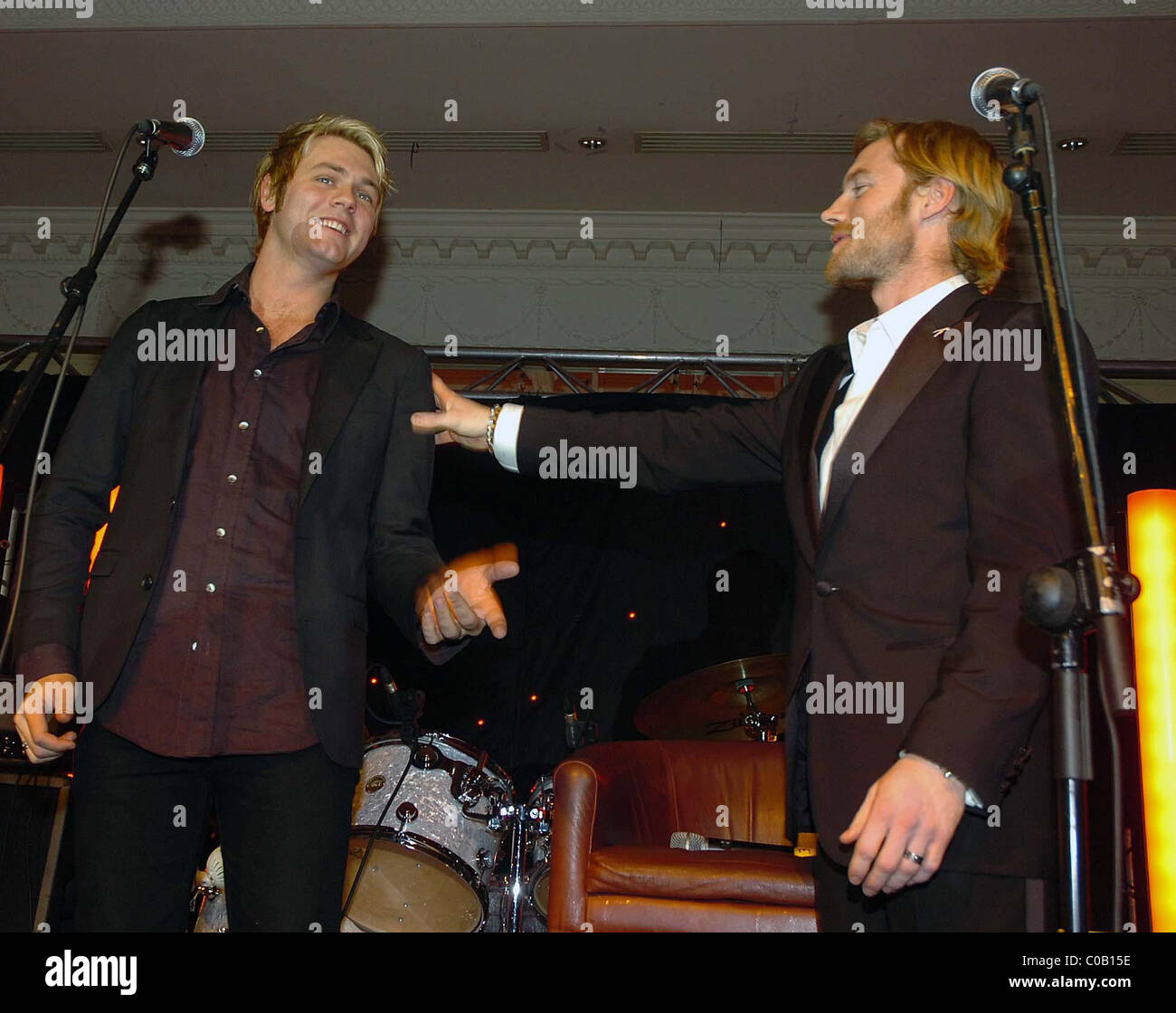 Brian McFadden and Ronan Keating performing at the Maire Keating ...