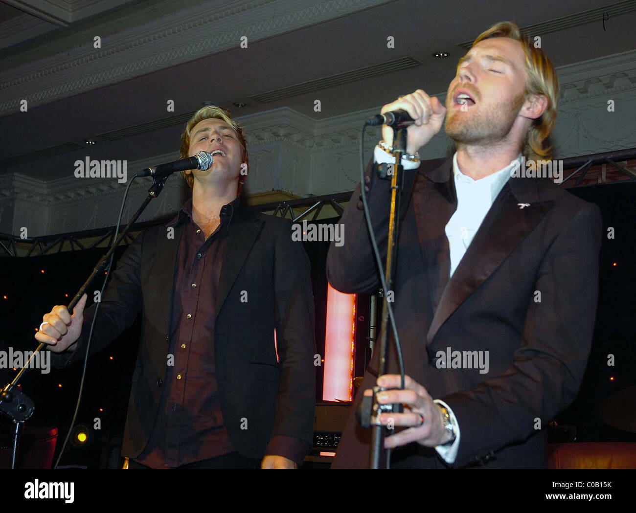 Brian McFadden and Ronan Keating performing at the Maire Keating ...