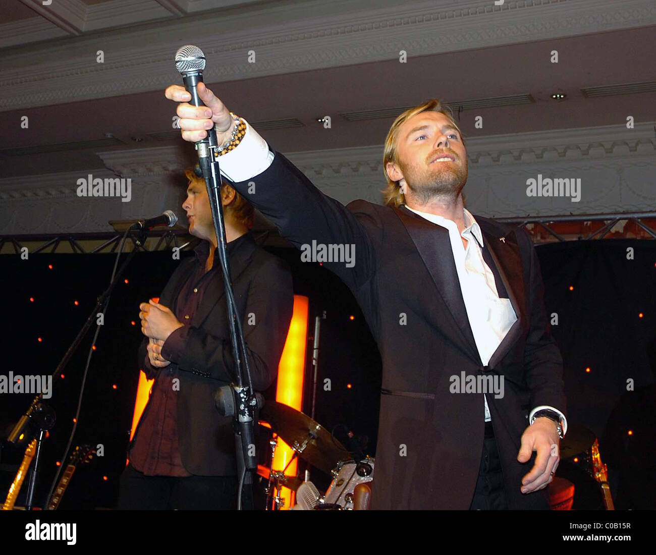 Brian McFadden and Ronan Keating performing at the Maire Keating ...