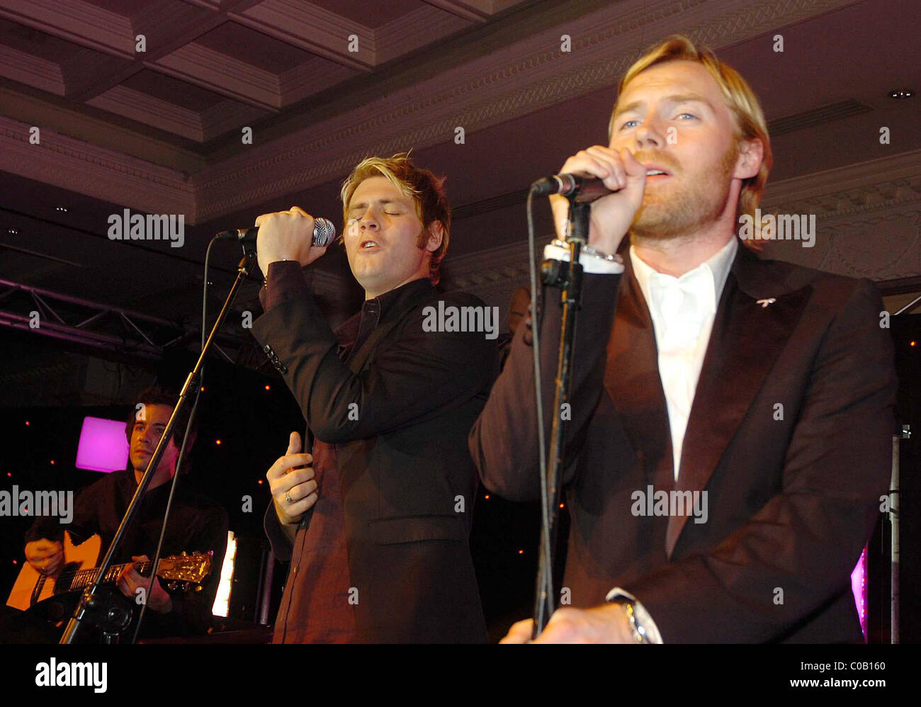 Brian McFadden and Ronan Keating performing at the Maire Keating ...